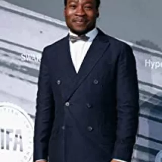 Mr. Ajayi (played by Fisayo Akinade) outfits on Heartstopper