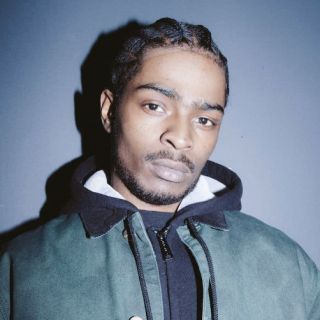 Collusion Track Jack­et worn by Bosco Champion (Malcolm Kamulete) as ...