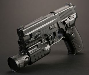 Stunt Sig Sauer P226 with surefire flashlight