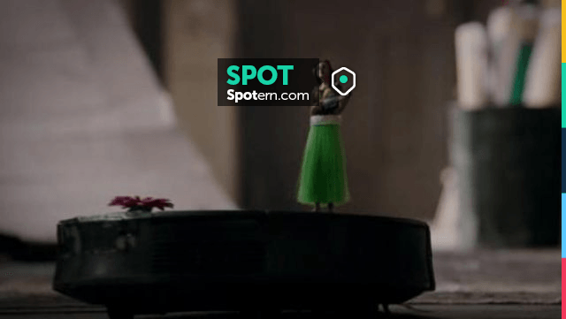 Hula dancer figurine with her Ukulélé sticked on the vacum cleaner of ...