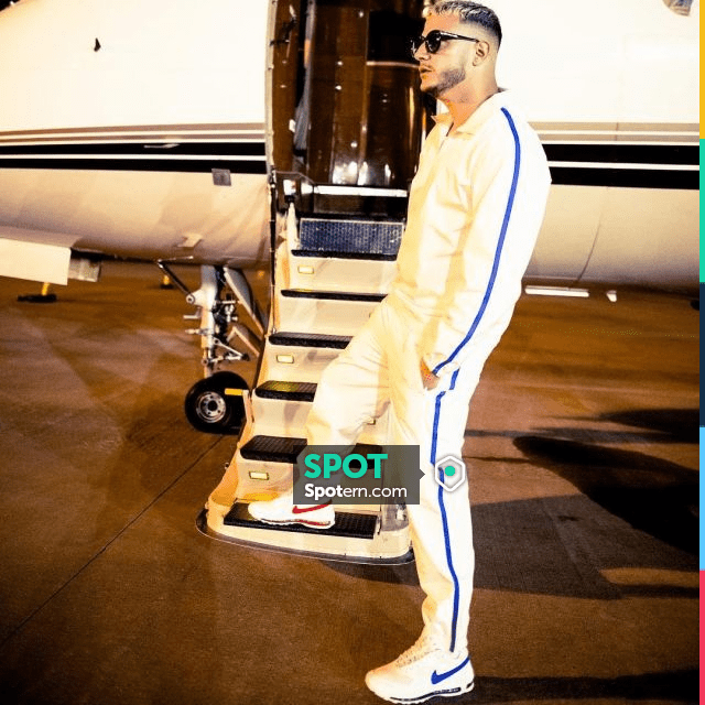 The tracksuit, with white stripes worn by DJ Snake on his account ...