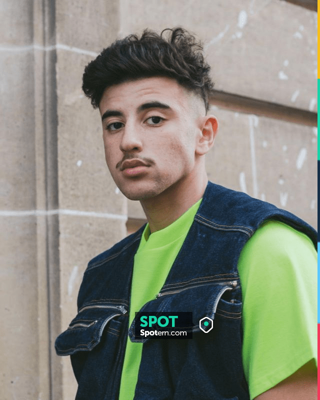 The jean jacket without sleeves that is worn by Just Riadh on his ...