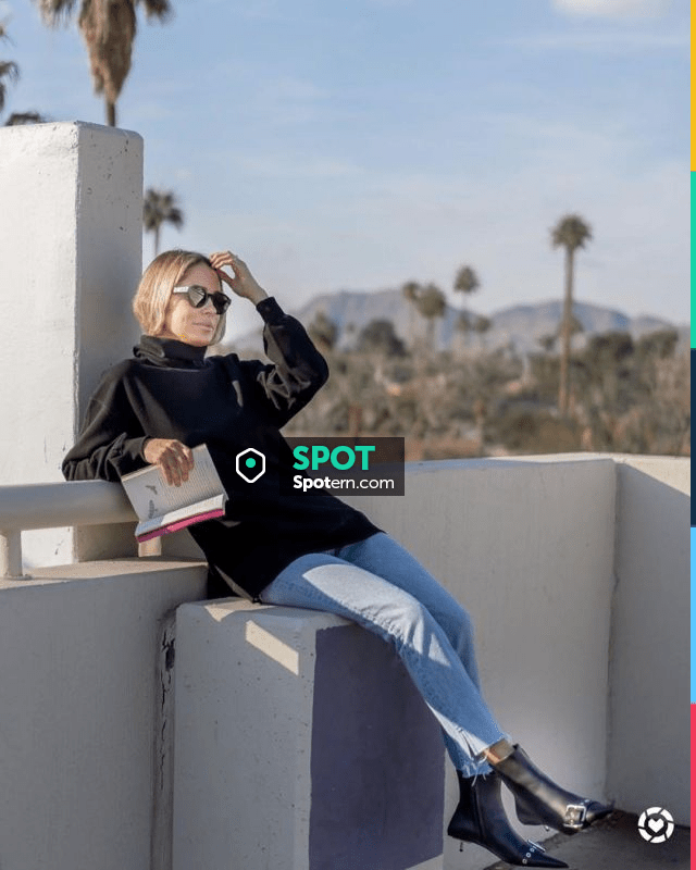 Suéter negro de cuello de tortuga de Candice Mathis en la cuenta de ...