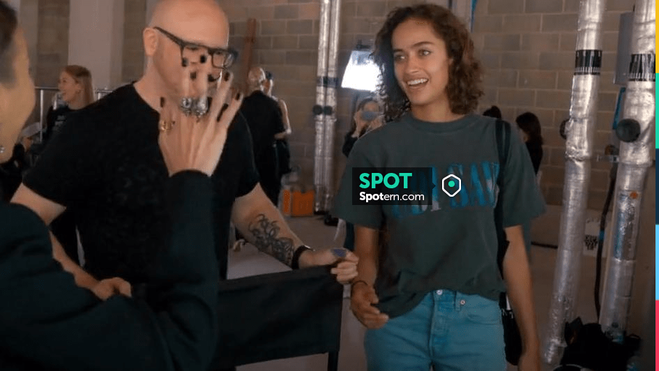 Kid Cudi Cu­di Saves graph­ic tee worn by Cate Hall as seen in Glow Up ...