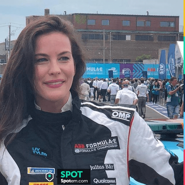Embroidered Michelin patch on racer jumpsuit worn by Liv Tyler at the ...
