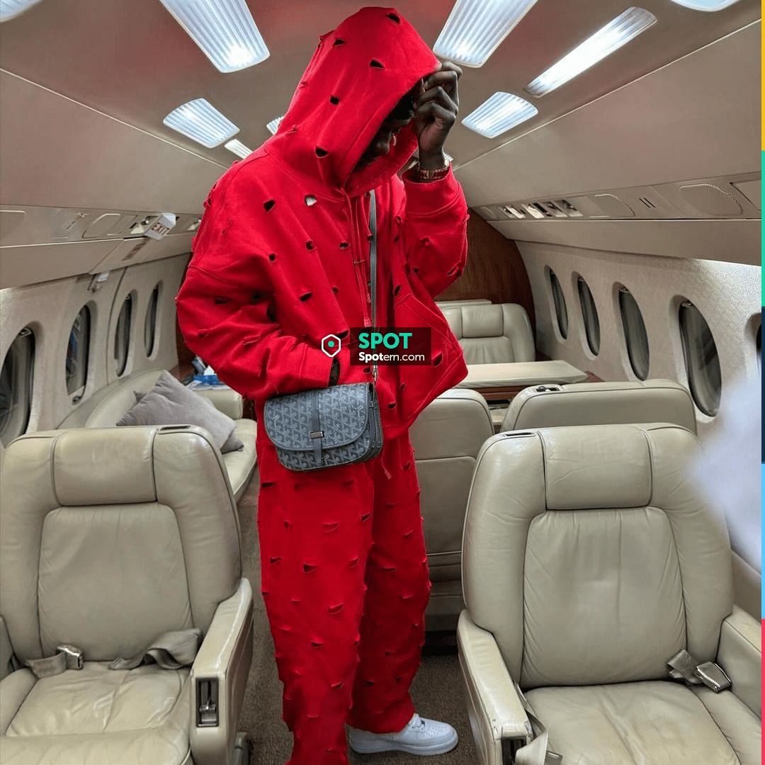 Eduardo Camavinga outfits: red tracksuit worn in a plane as seen on his ...