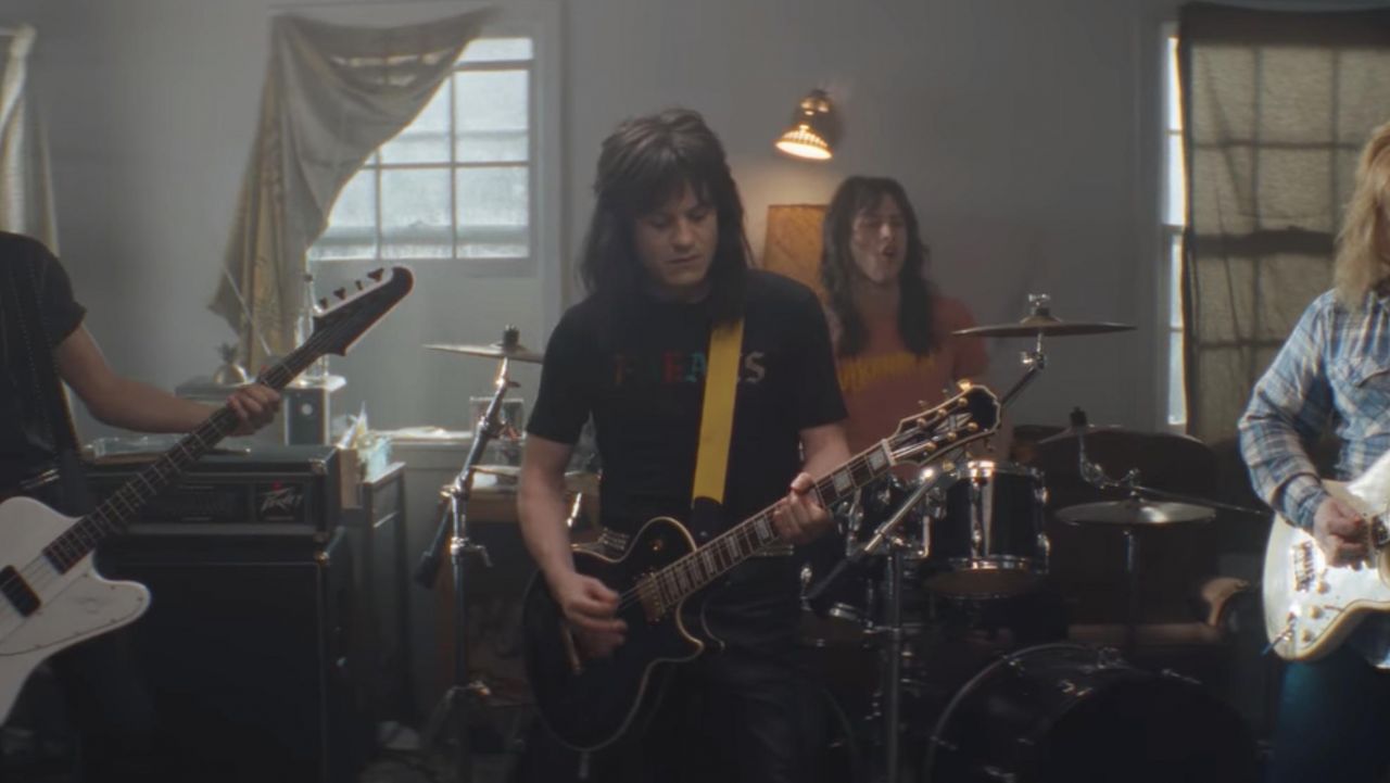 Freaks black T-shirt worn by Mick Mars (Iwan Rheon) as seen in The Dirt ...