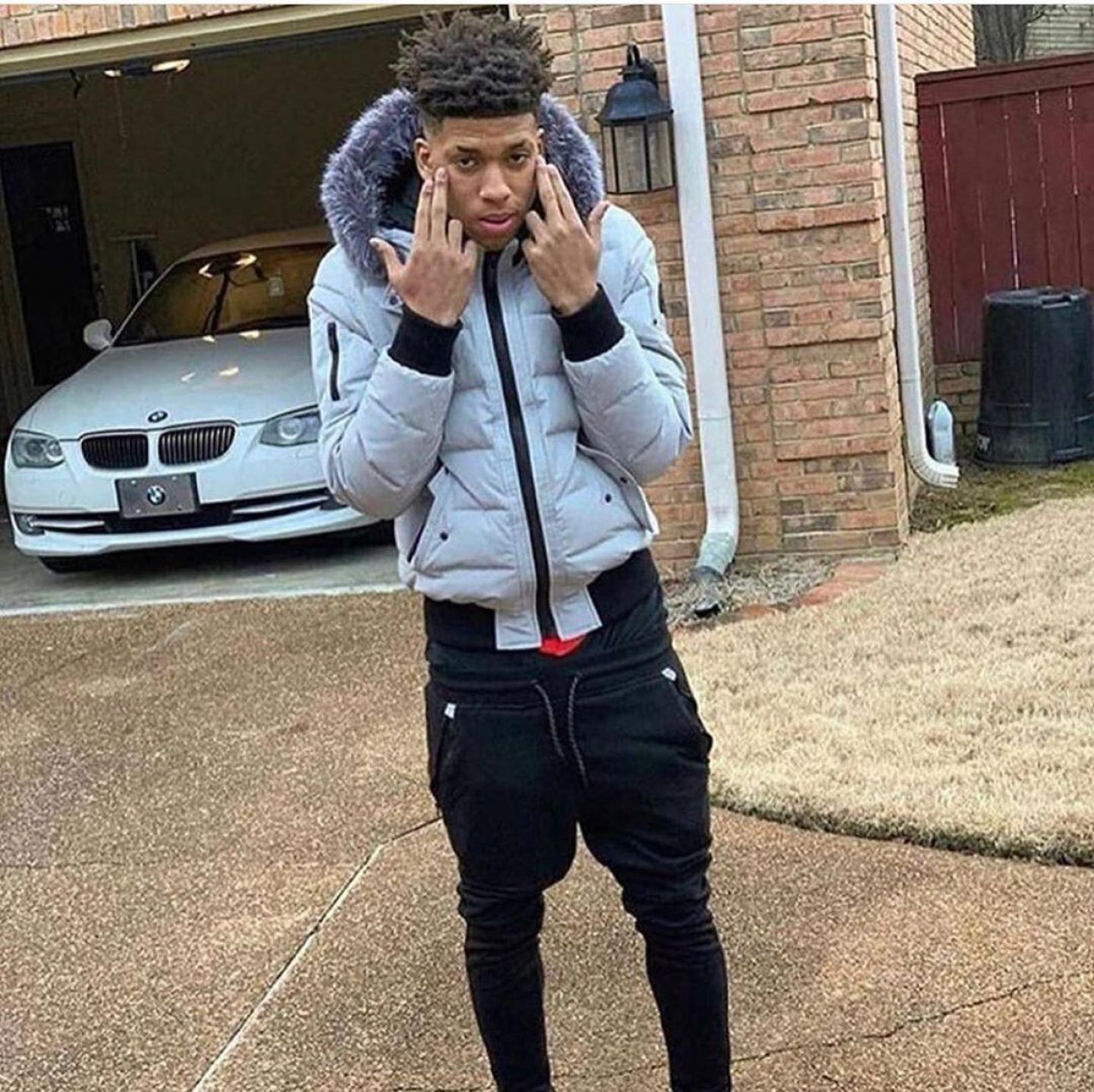 White puffer jacket worn by NLE Choppa as seen on his Instagram account ...