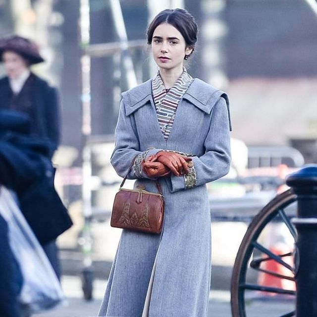 The blue coat worn by Lily Collins aka Edith Bratt on the set of the ...