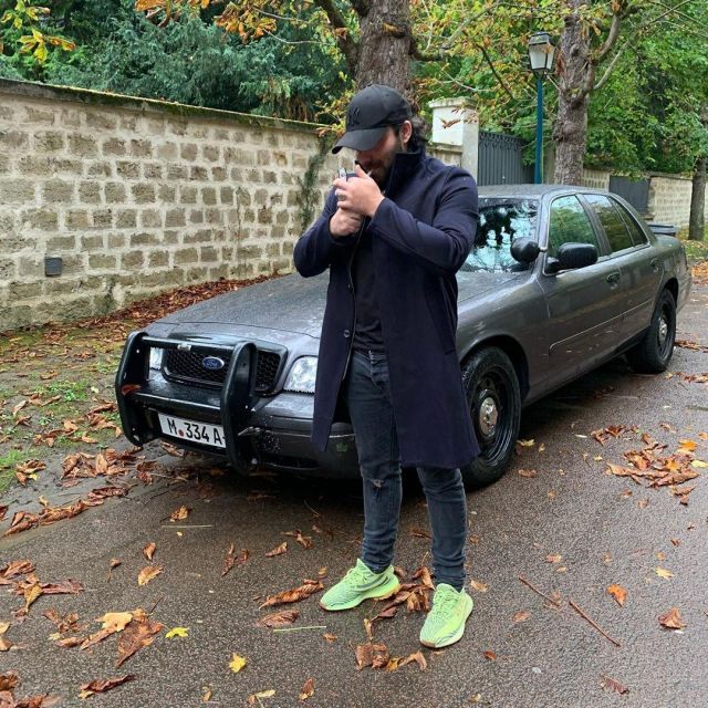 The jacket mid-long, navy blue worn by Akram Ojjeh Junior on his ...