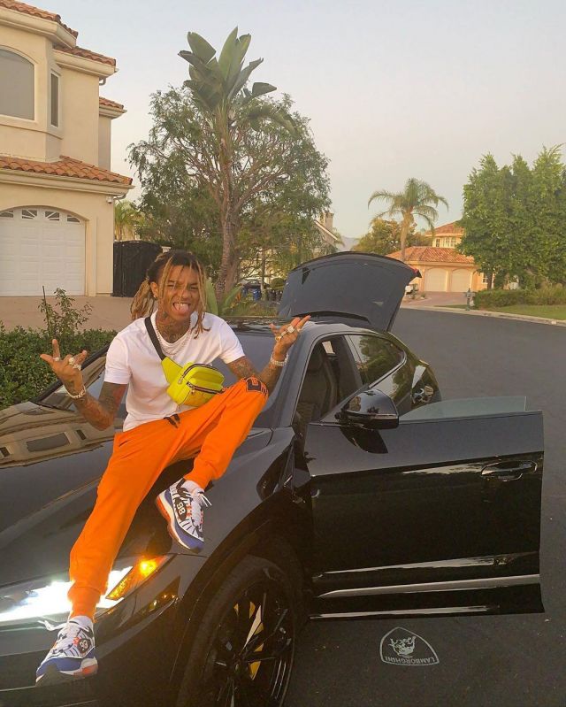 The sneakers blue, white, and orange with number 98 carried by Swae Lee ...
