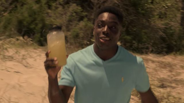 Ralph Lauren turquoise t-shirt worn by Kelce (Deion Smith) as seen in ...