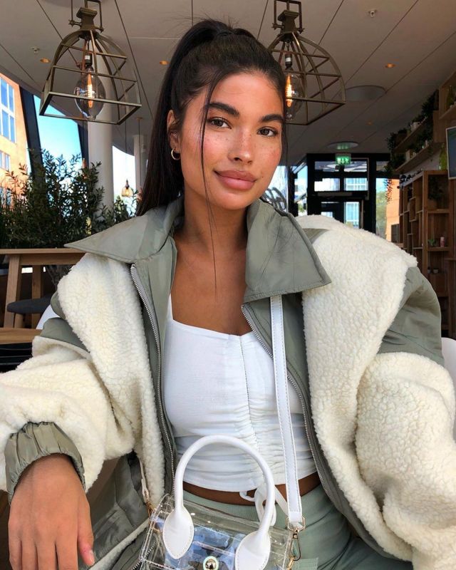 White Slinky Ruched Front Long Sleeve Crop Top of Aisha Potter on her ...