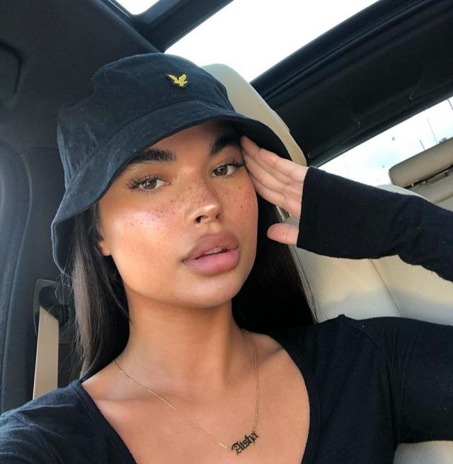 Lyle & Scott Black Ea­gle Buck­et Hat of Aisha Potter on her Instagram ...