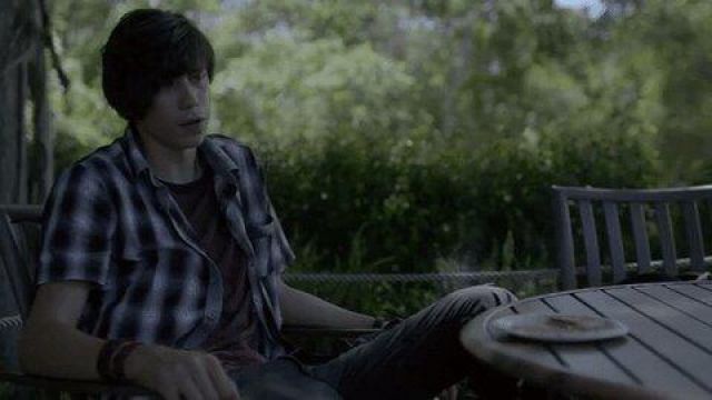 Grey and white short-sleeved shirt of Nolan Rayburn (Owen Teague) in ...