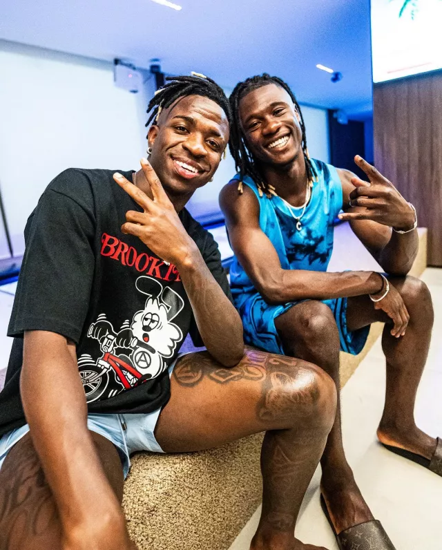 Louis Vuitton Brown Mono­gram Wa­ter­front Slides worn by Eduardo ...