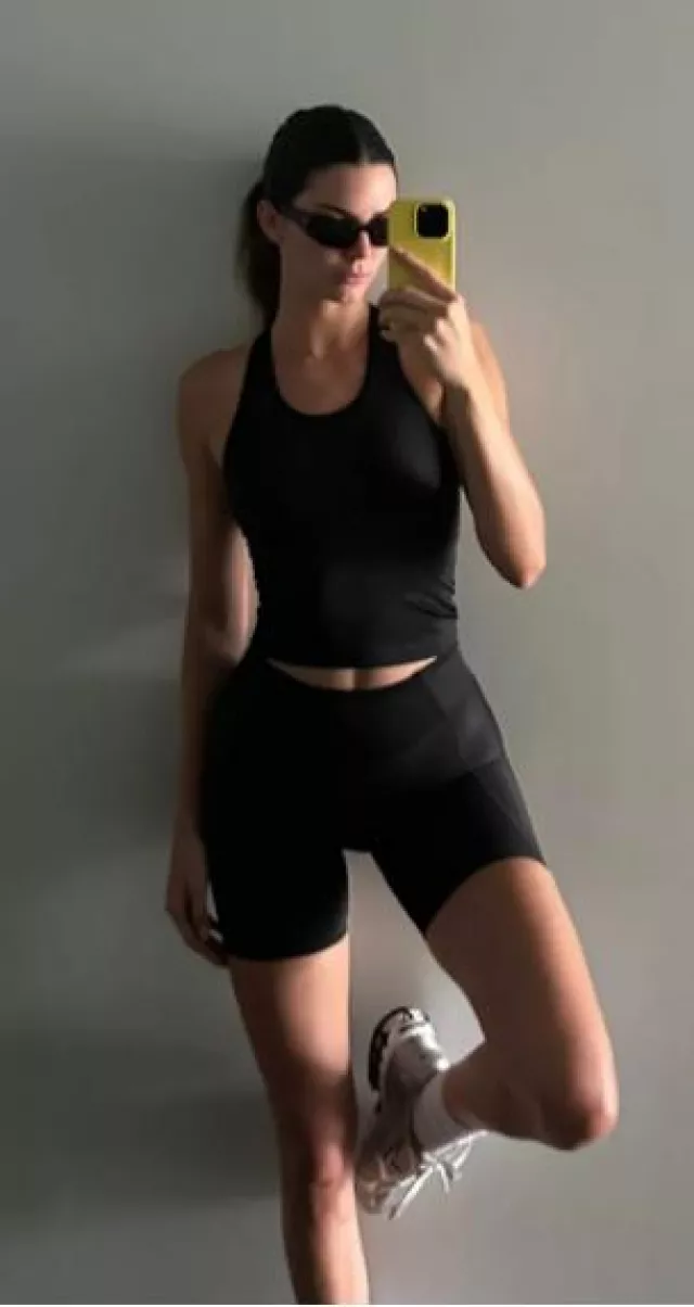 Skims Performance High-Waisted Bike Short in Onyx worn by Kendall ...