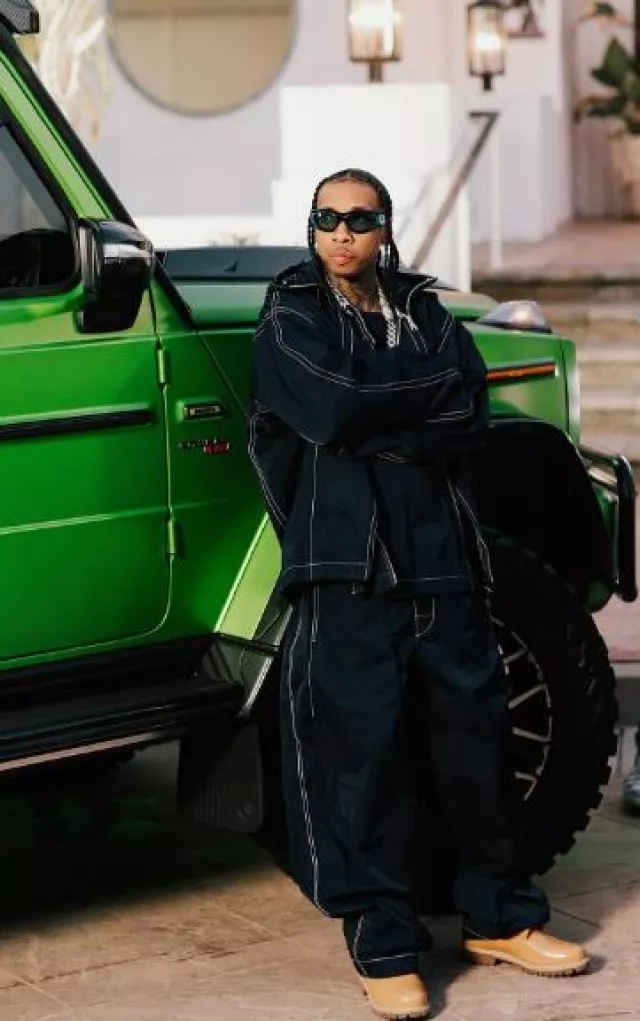 Bottega Veneta Navy Blue Bar­rel Leg Pants worn by Tyga on the ...