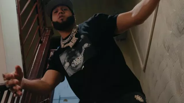 Nahmias Kodak Black Black Grillz Print T-Shirt worn by El Alfa “El Jefe” in LOS PANAS with ...