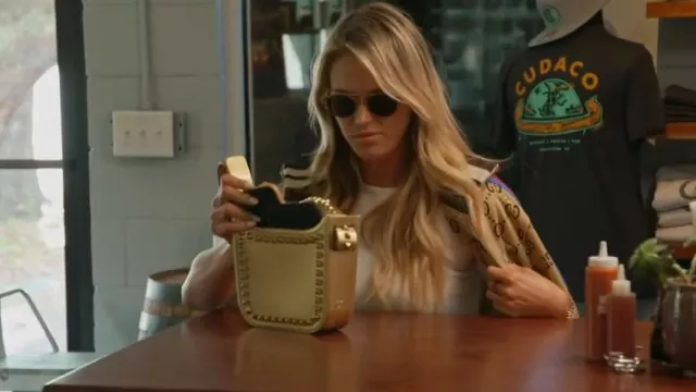 Carmen Sol Toni Mid Cross­body In Gold worn by Olivia Flowers as seen ...