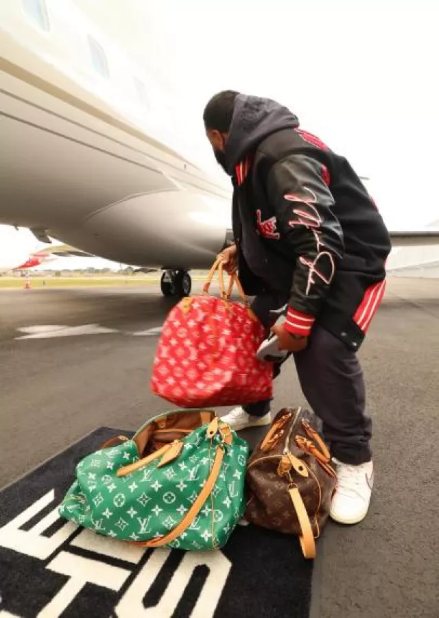 Louis Vuitton Red Monogram Speedy 50 Bag worn by DJ Khaled on the ...