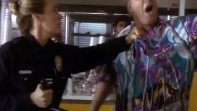 Nightstick of Officer Petrovich (Diane Delano) in Cop Rock (S01E09 ...