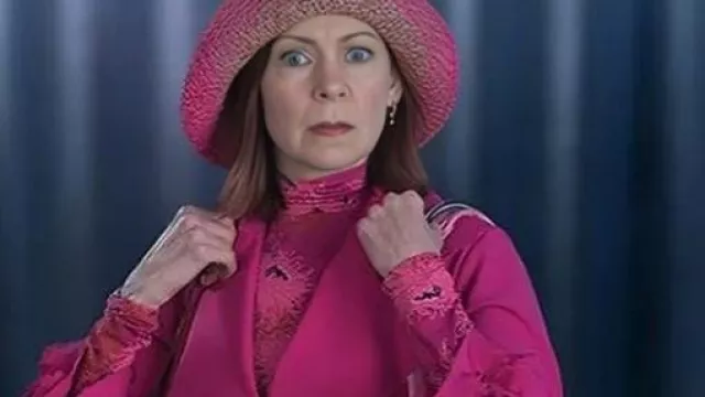 Wardrobe of Elsbeth Season 2: Carrie Preston wears Pink Trench Coat to ...