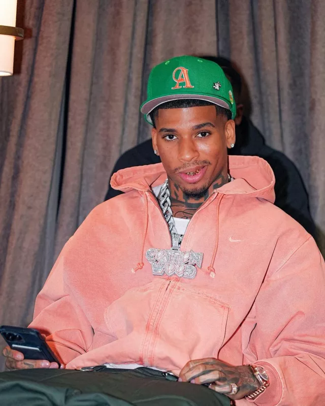 Nike Faded Orange Hooded Workwear Jacket worn by NLE Choppa on the ...