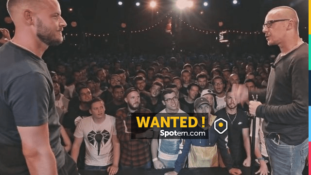 The jacket worn by a member of the public in the video Rap Contenders ' 13 : Wojtek vs Hermano ...