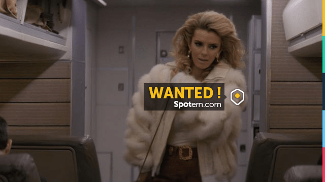 The jacket of white fur, worn by Debbie Eagan (Betty Gilpin) in GLOW ...