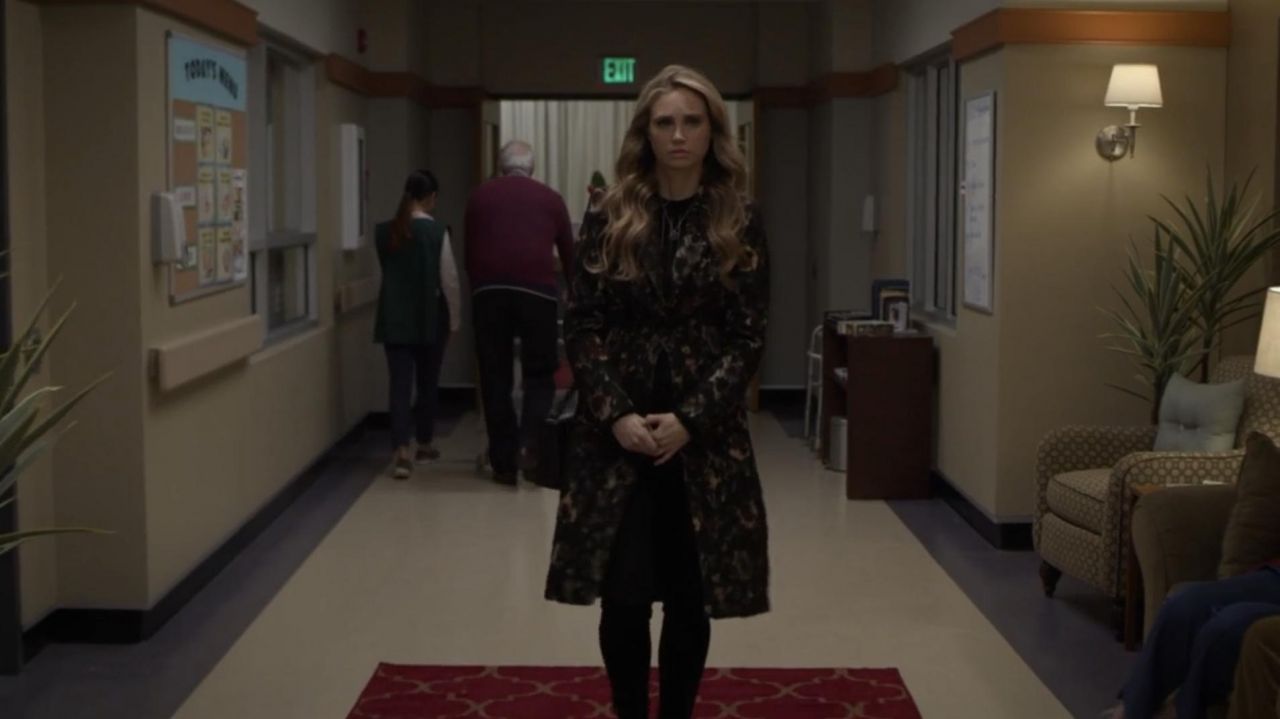 Dark floral textured coat dress worn by Dr. Morgan Reznick (Fiona Gubel ...