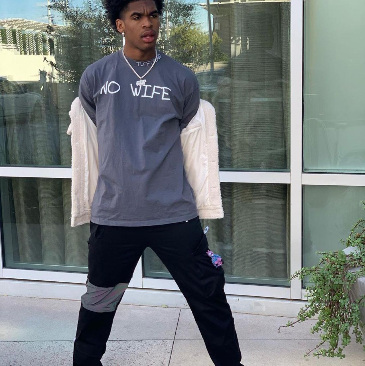 The cargo pants in black worn by Josh Christopher on his account ...