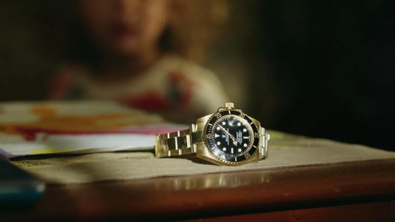 Rolex gold watch of Allison (Florence Pugh) as seen in A Good Person ...