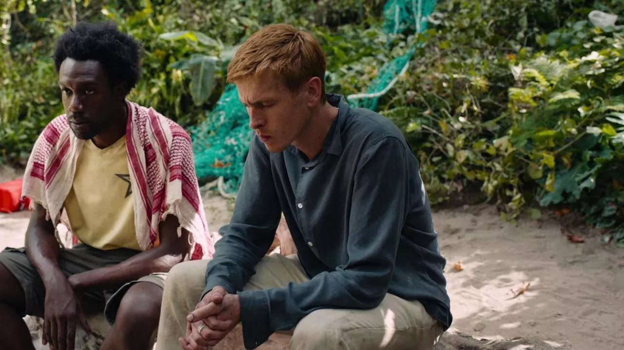 Triangle of Sadness Movie Outfits: Carl (Harris Dickinson) is wearing ...