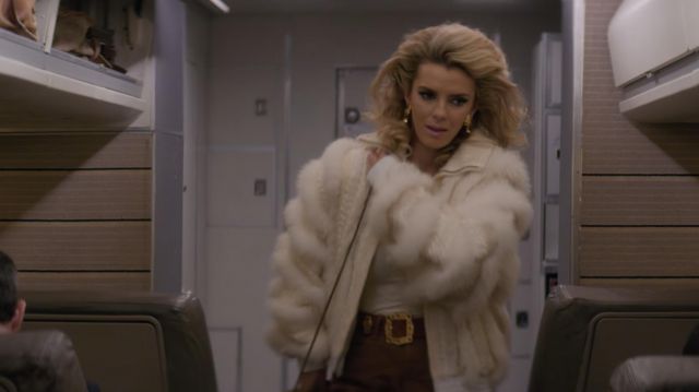 The jacket of white fur, worn by Debbie Eagan (Betty Gilpin) in GLOW ...